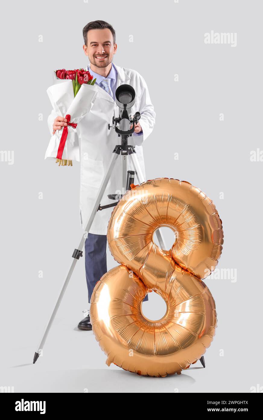 Happy male astronomer with tulips, balloon in shape of figure 8 and ...