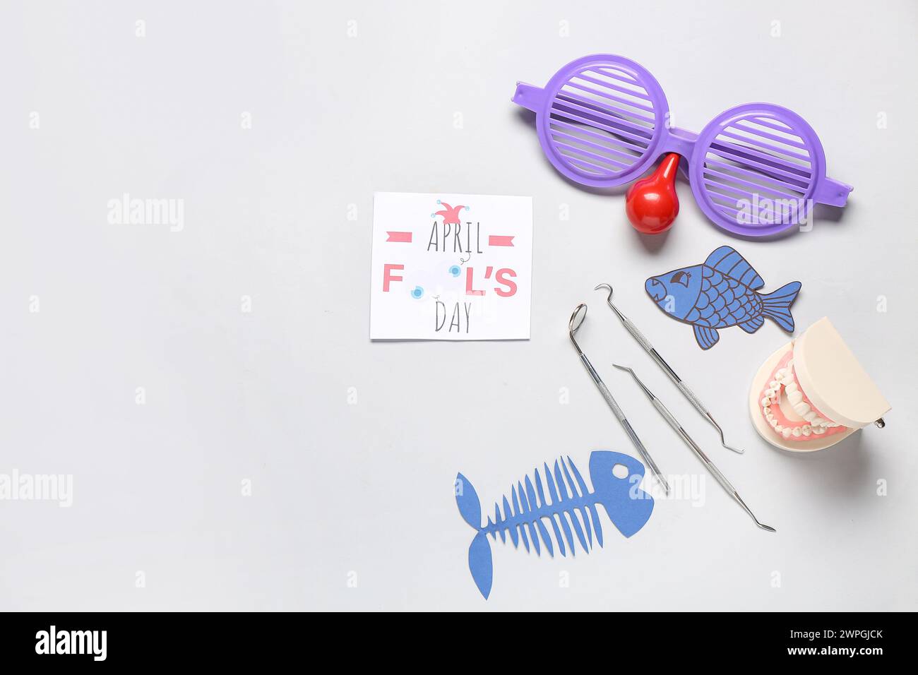 April Fool's Day card with dentist tools, funny glasses and paper ...