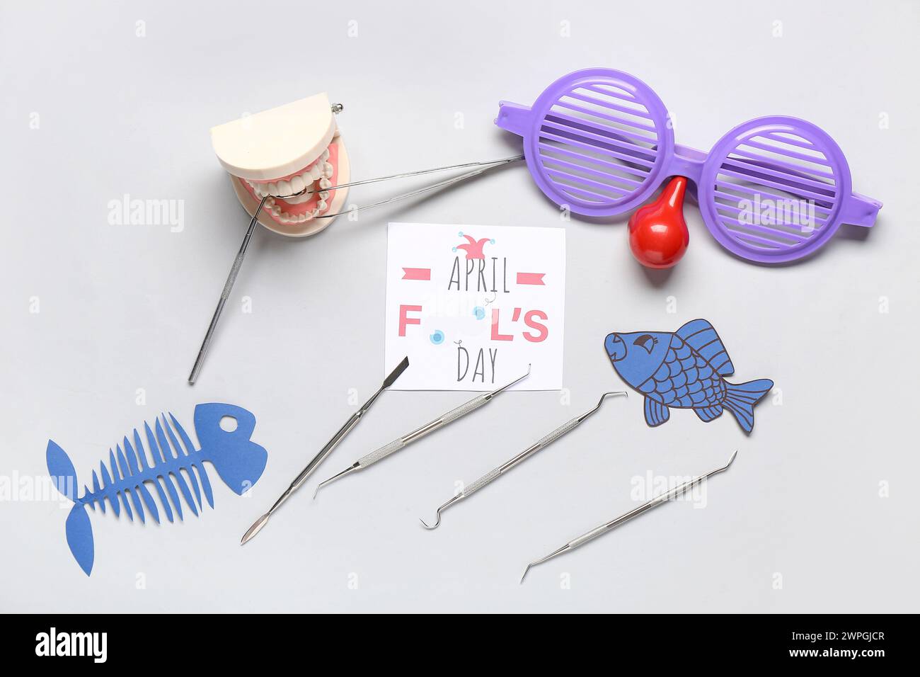 April Fool's Day card with dentist tools, funny glasses and paper ...