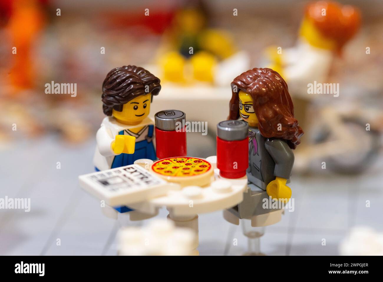 Lego Couple Sitting Behind the Restaurant Table with Pizza Stock Photo ...