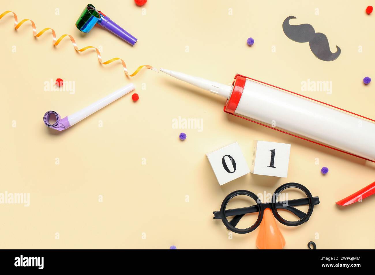 Funny glasses with construction adhesive and party decor on beige ...