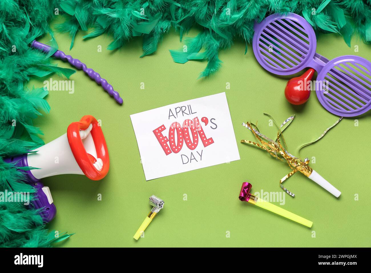 April Fool's Day card with funny glasses, megaphone and feathers on ...
