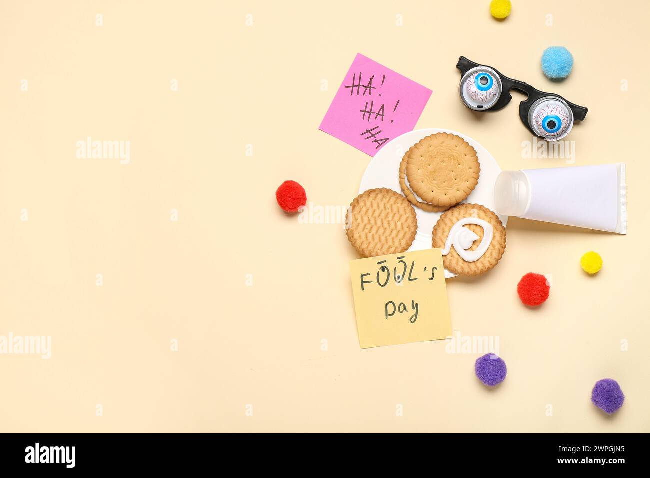 Cookies with toothpaste, funny glasses and sticky notes on beige ...