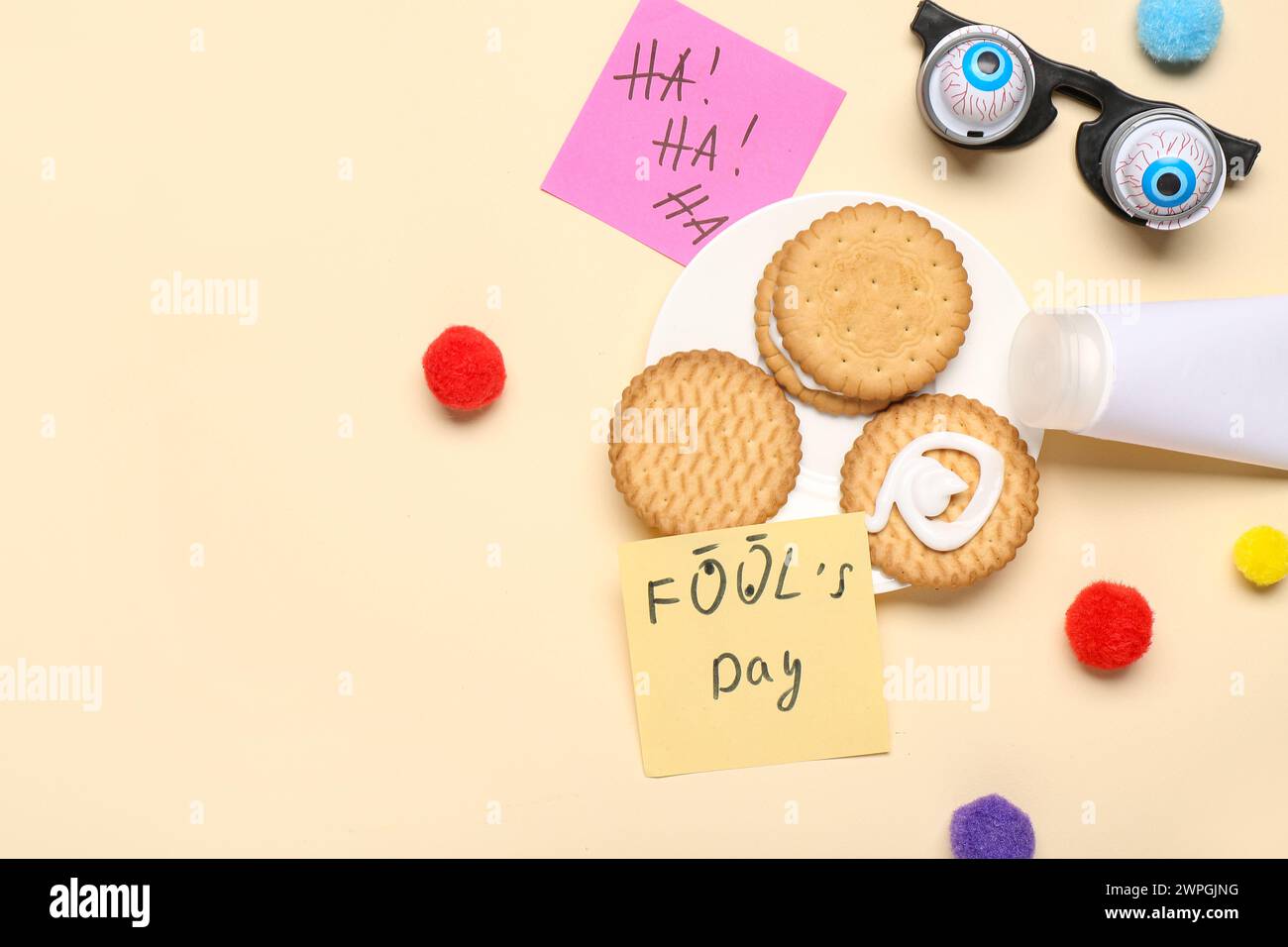 Cookies with toothpaste, funny glasses and sticky notes on beige ...