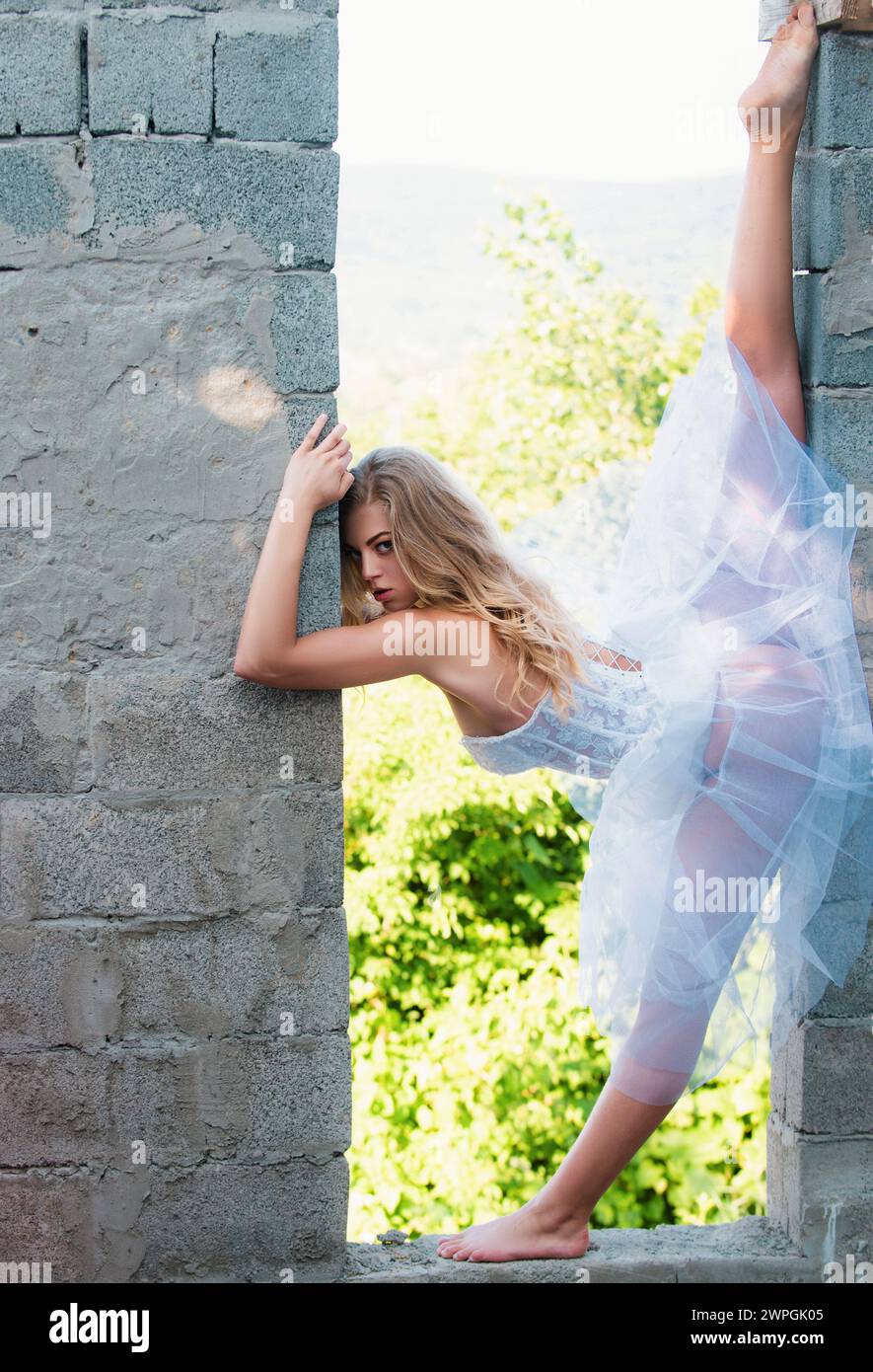 ballet dancer leg-split, flexible girl doing split. Young fit woman ...
