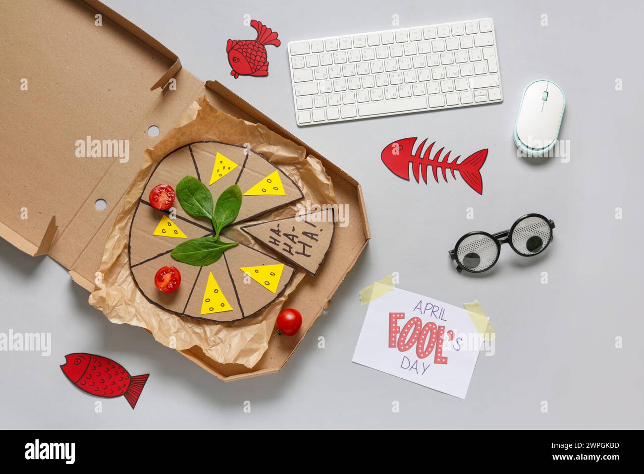 Carton pizza with computer keyboard, funny glasses and fishes on white ...