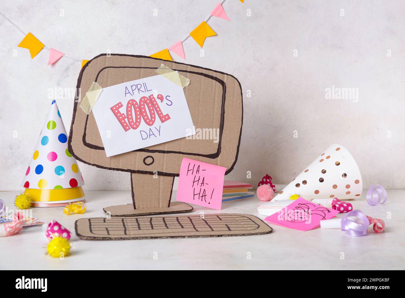 Carton computer screen with keyboard, party decor and sticky notes on ...