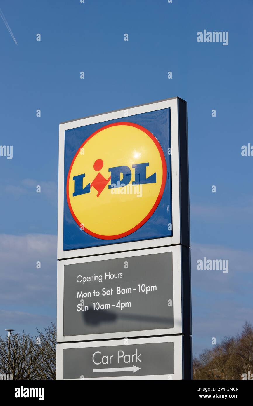 Lidl supermarket sign with blue sky and sunshine in radcliffe near bury ...