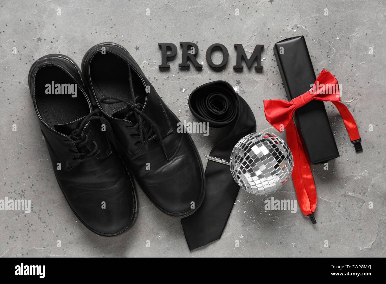 Word PROM with male shoes, tie and gift box on grey grunge background ...