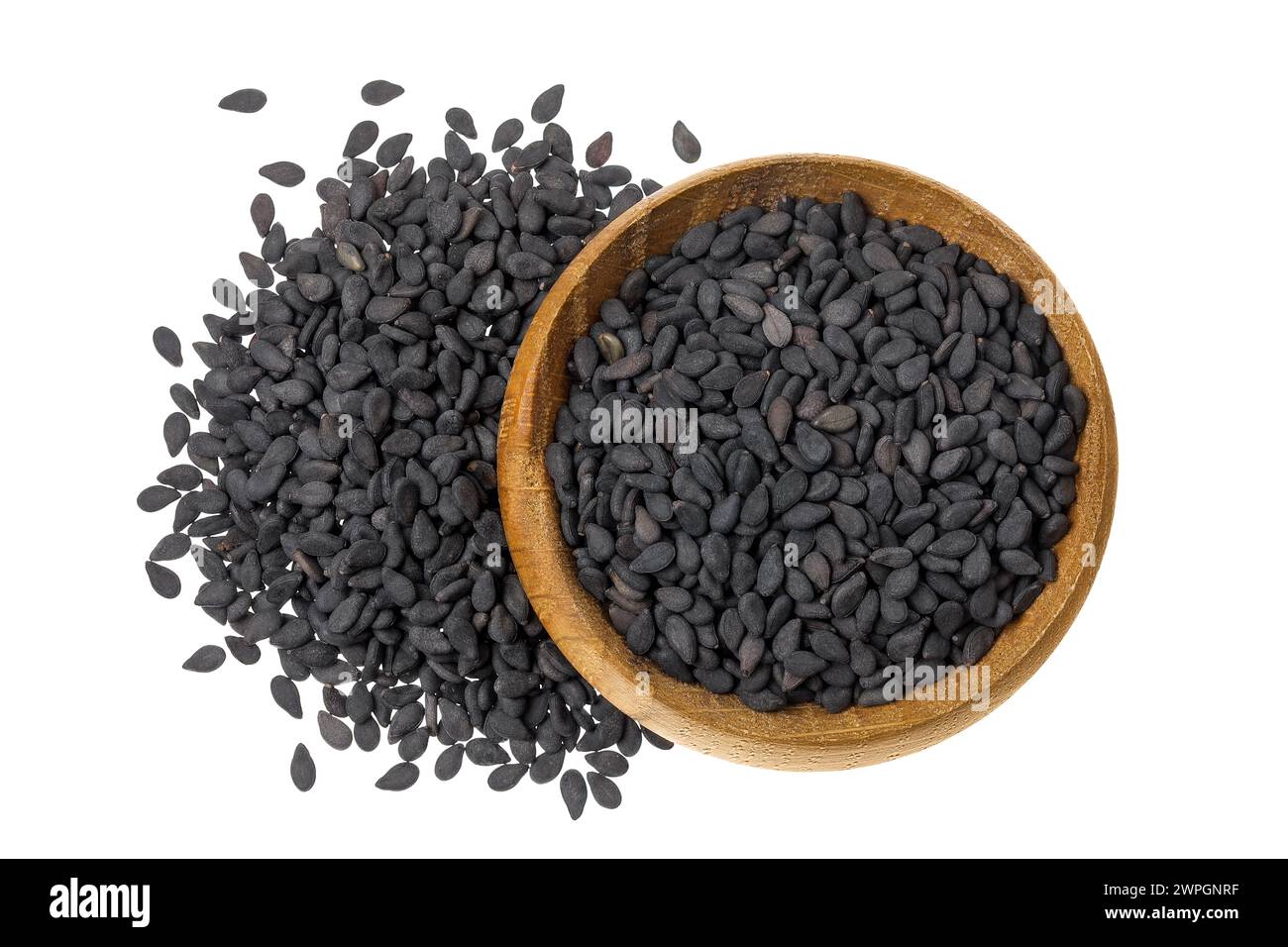 black sesame seeds in wooden bowl isolated on white background. Top ...