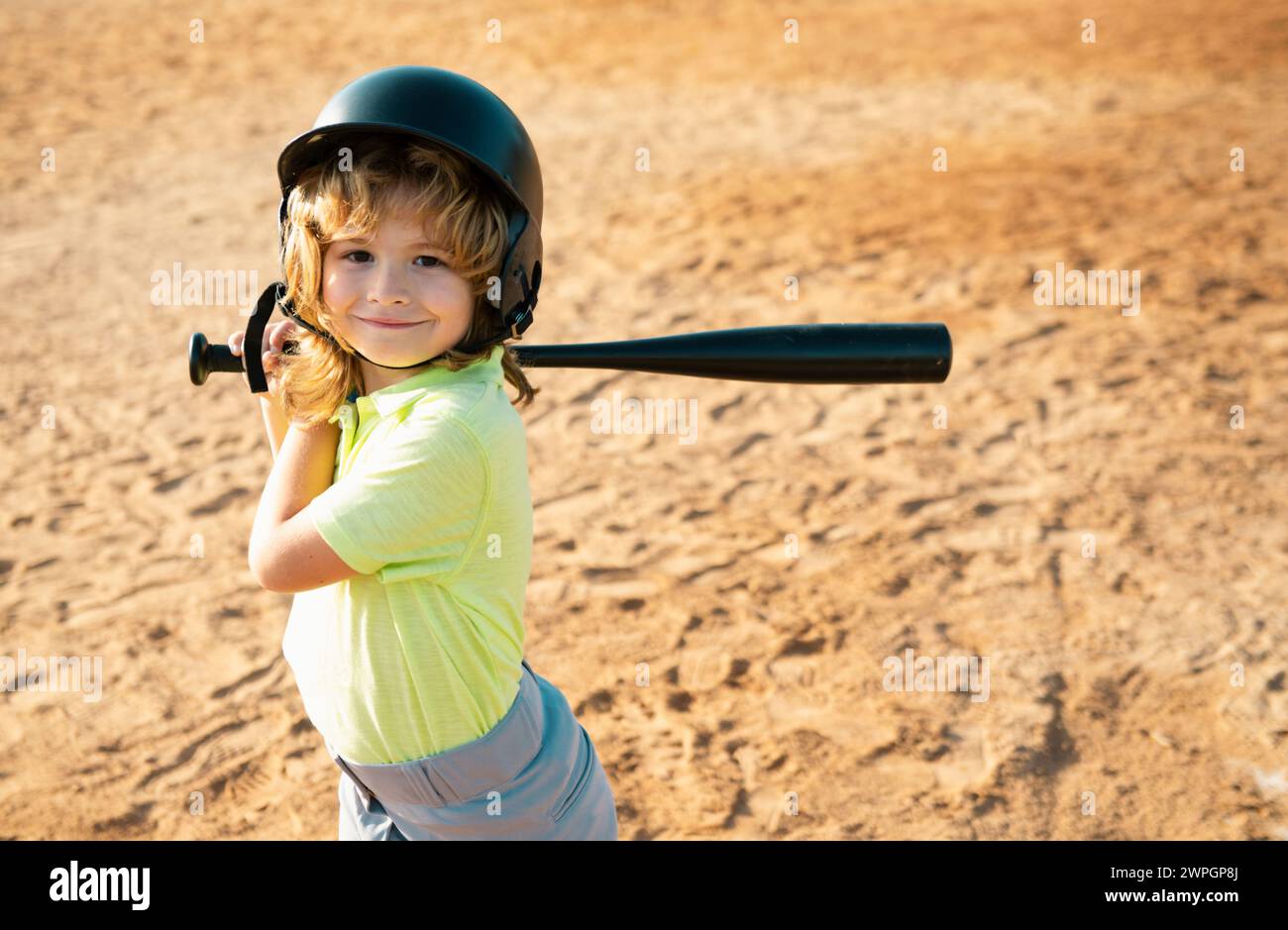 Boy in baseball helmet and baseball bat ready to bat Stock Photo - Alamy