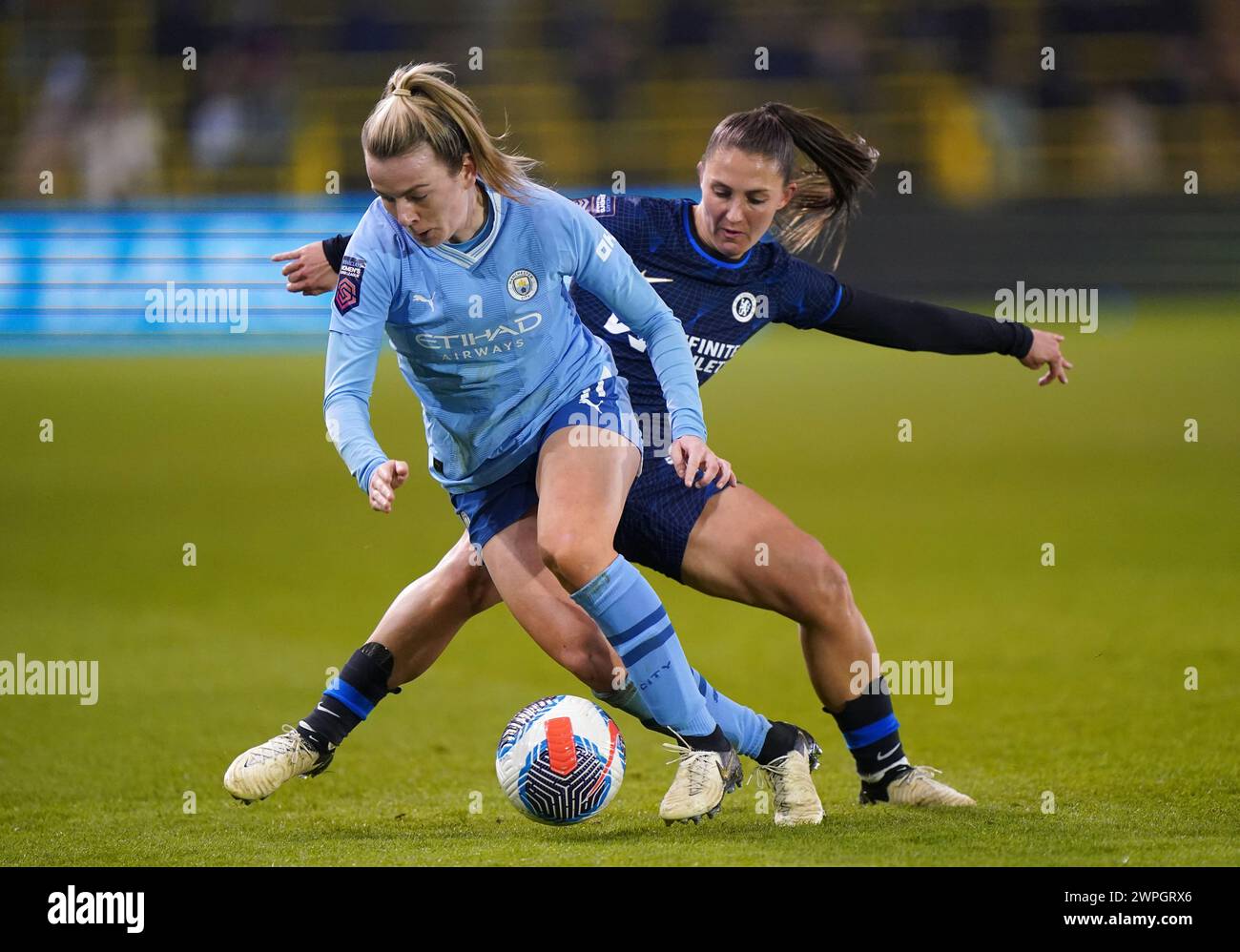 Manchester City's Lauren Hemp (left) and Chelsea's Eve Perisset battle ...