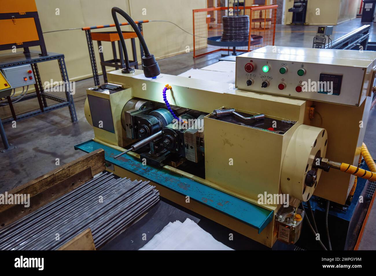 Lathe machine tapping steel rods Stock Photo - Alamy