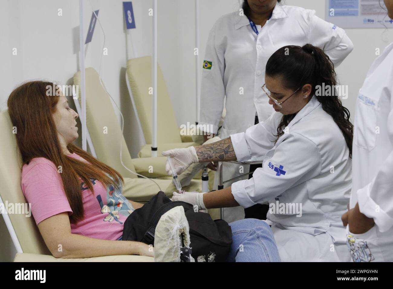 Patients with dengue fever and symptoms of the disease seek medical ...