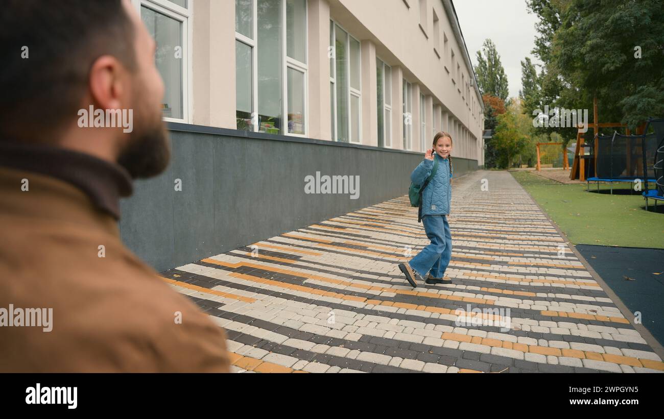 Father walk daughter to school family tender relations goodbye wave ...