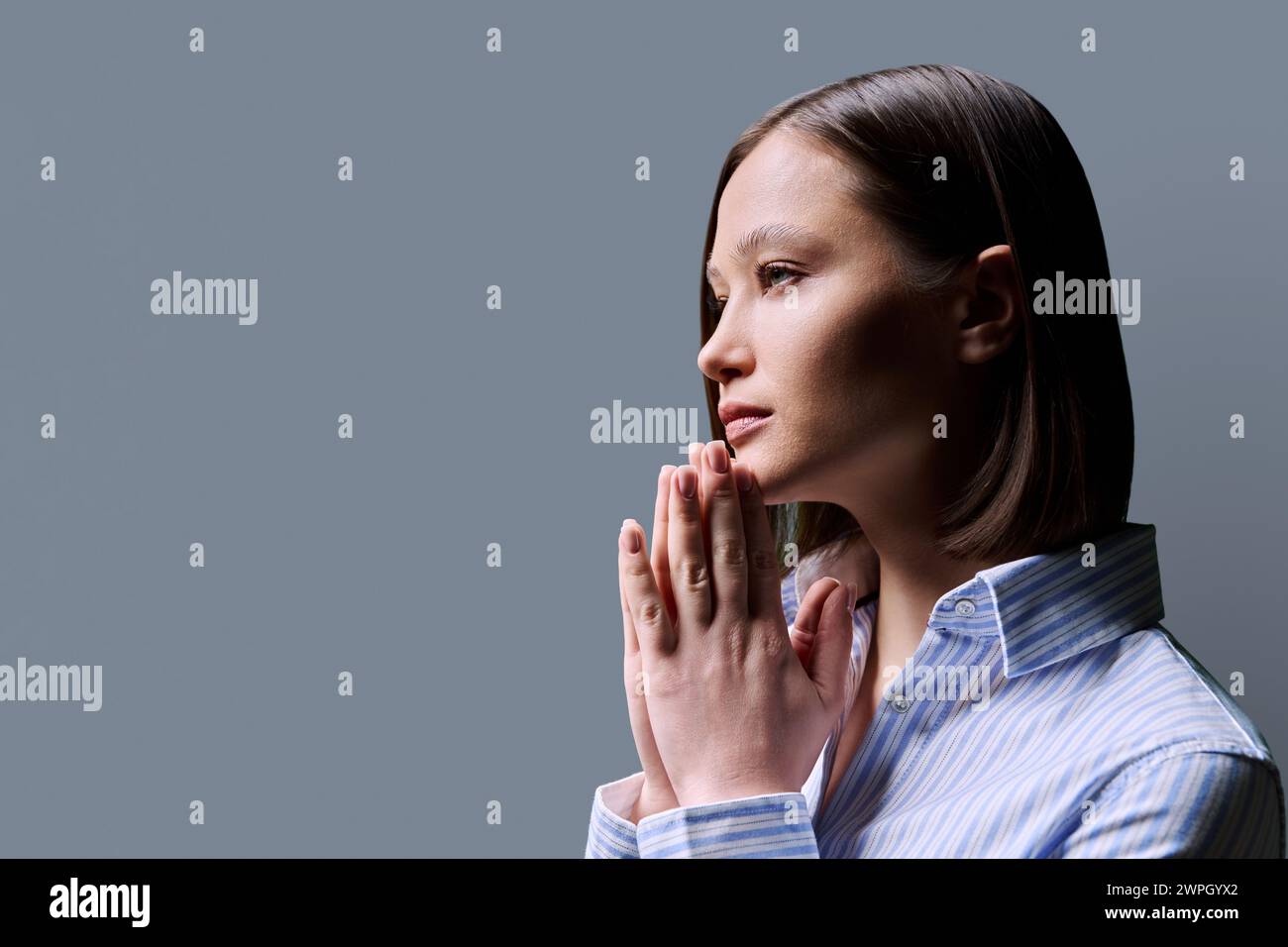 One woman praying looking up hi-res stock photography and images - Alamy