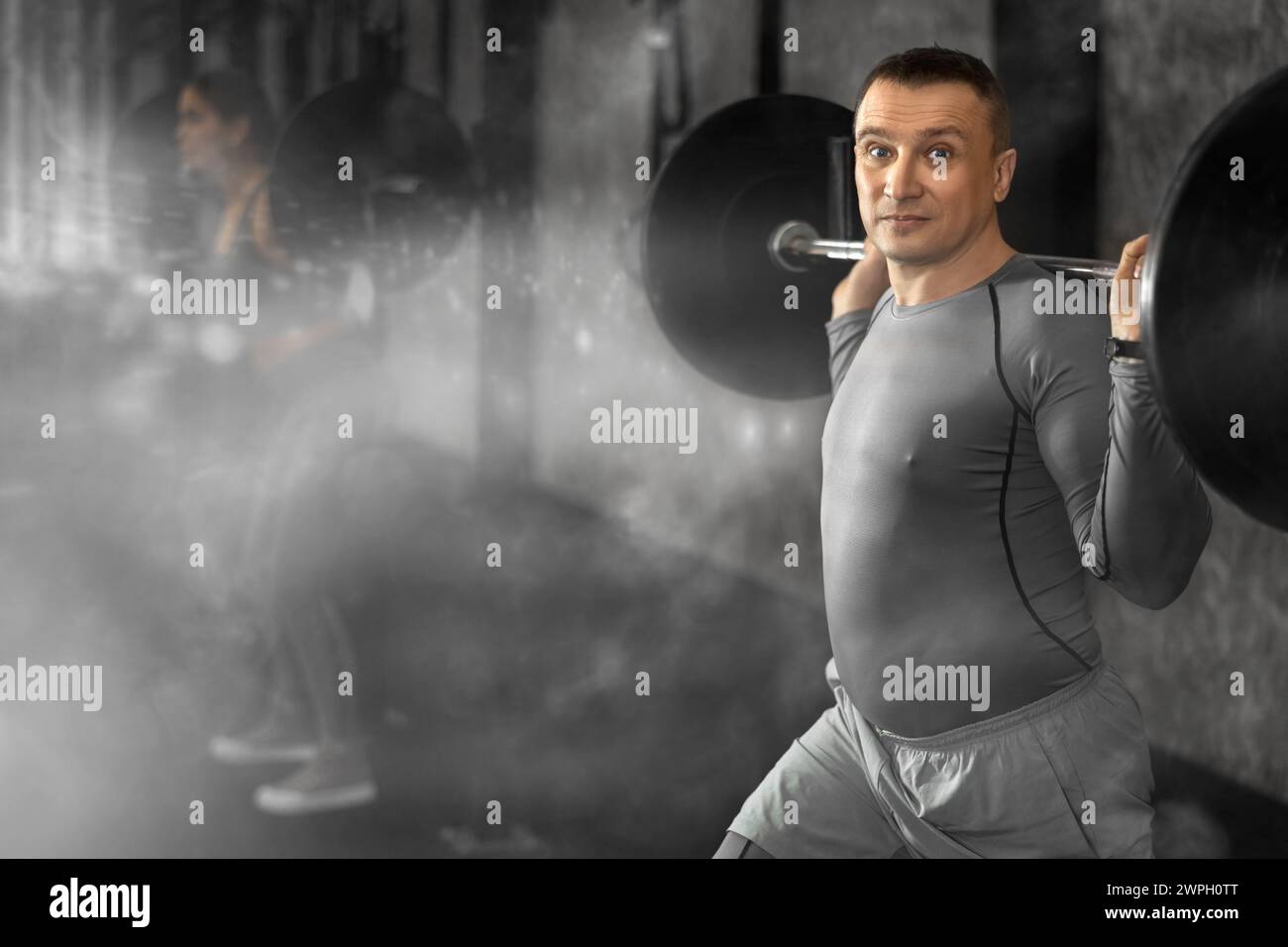 Athlete middle aged man during exercises to strengthen muscles of back ...