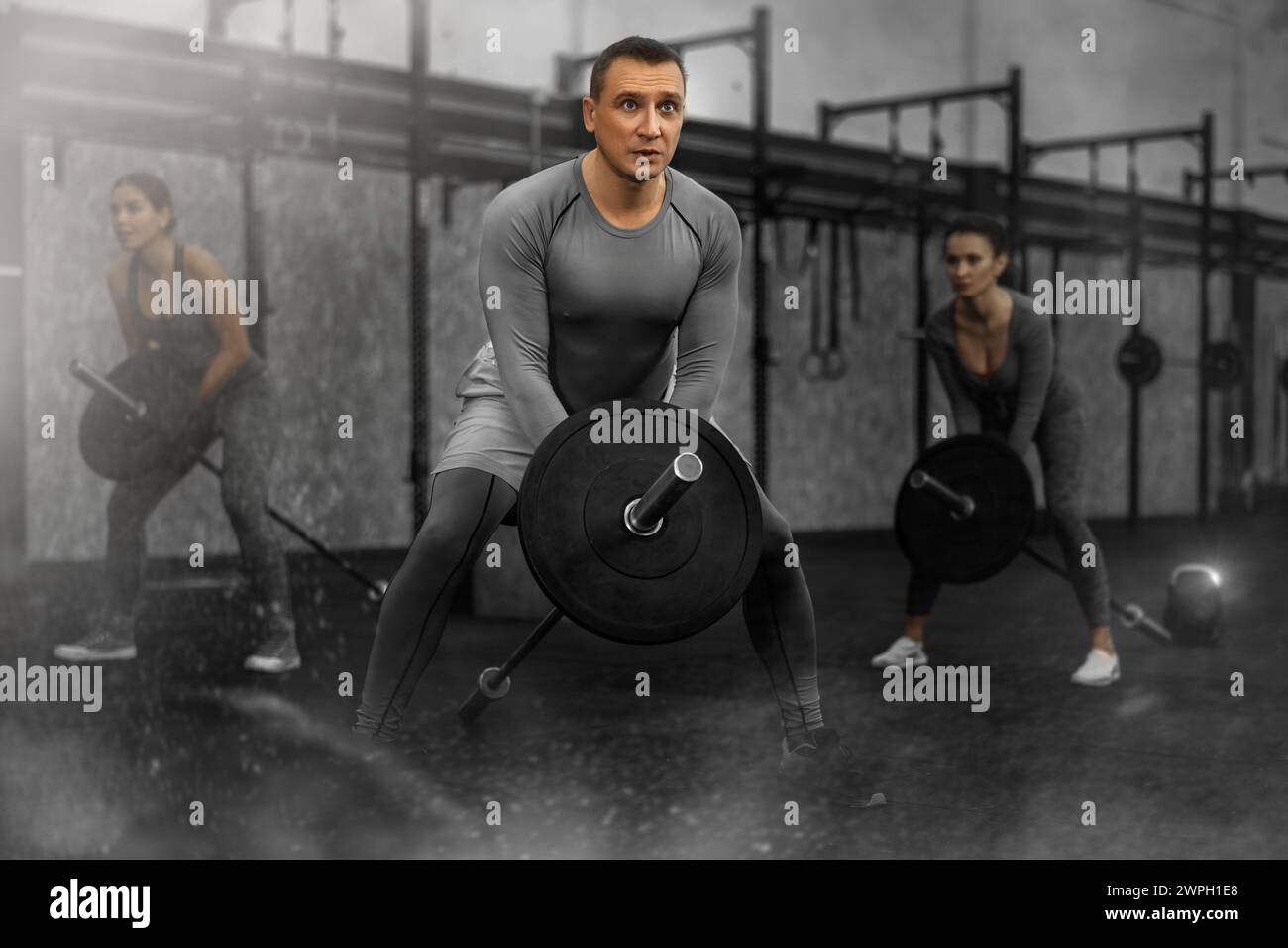 Man trains muscles of arms and back using barbell and differentiated ...