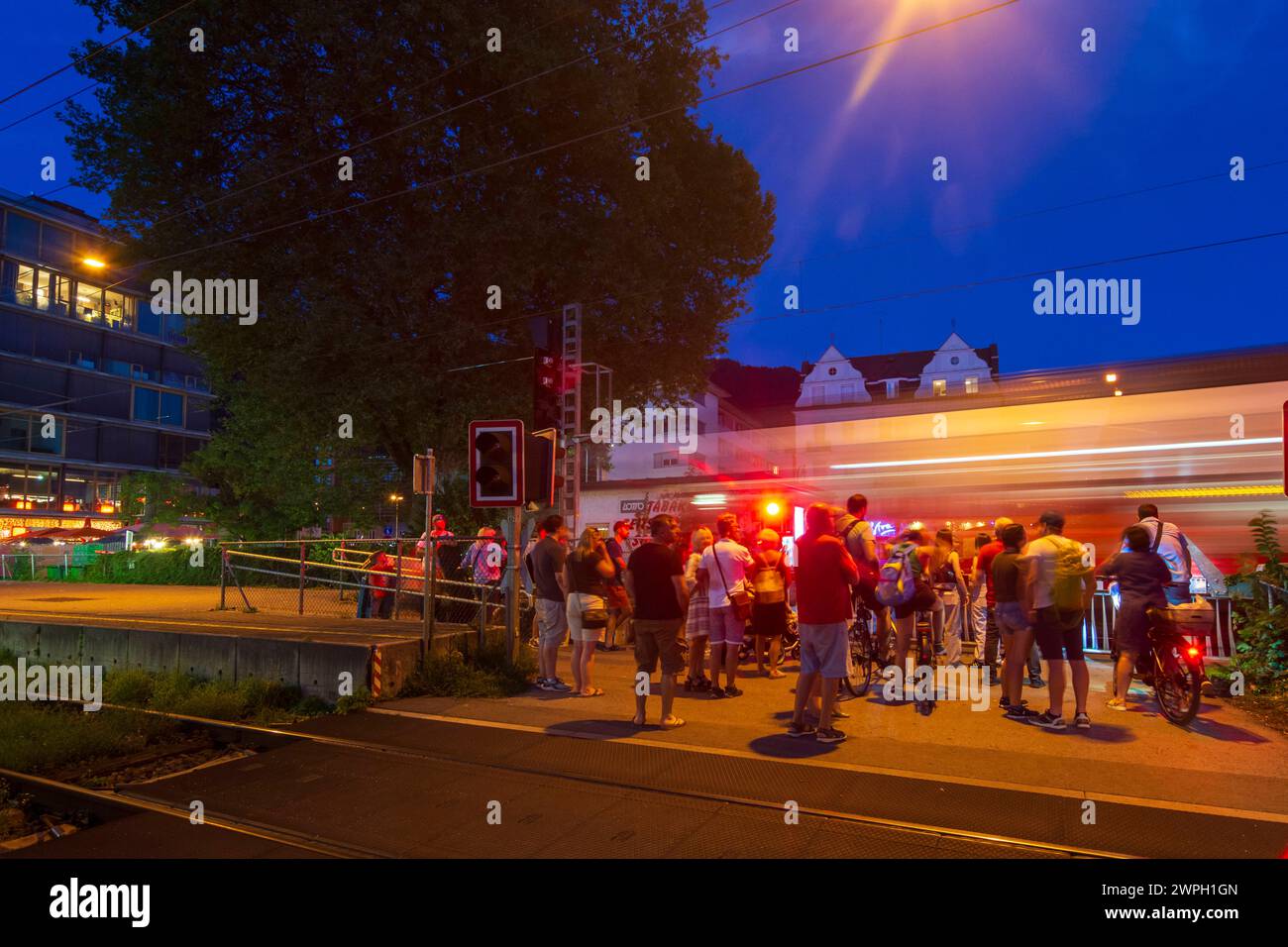 railway station Bregenz Hafen, S-Bahn train of ÖBB, railway crossing ...