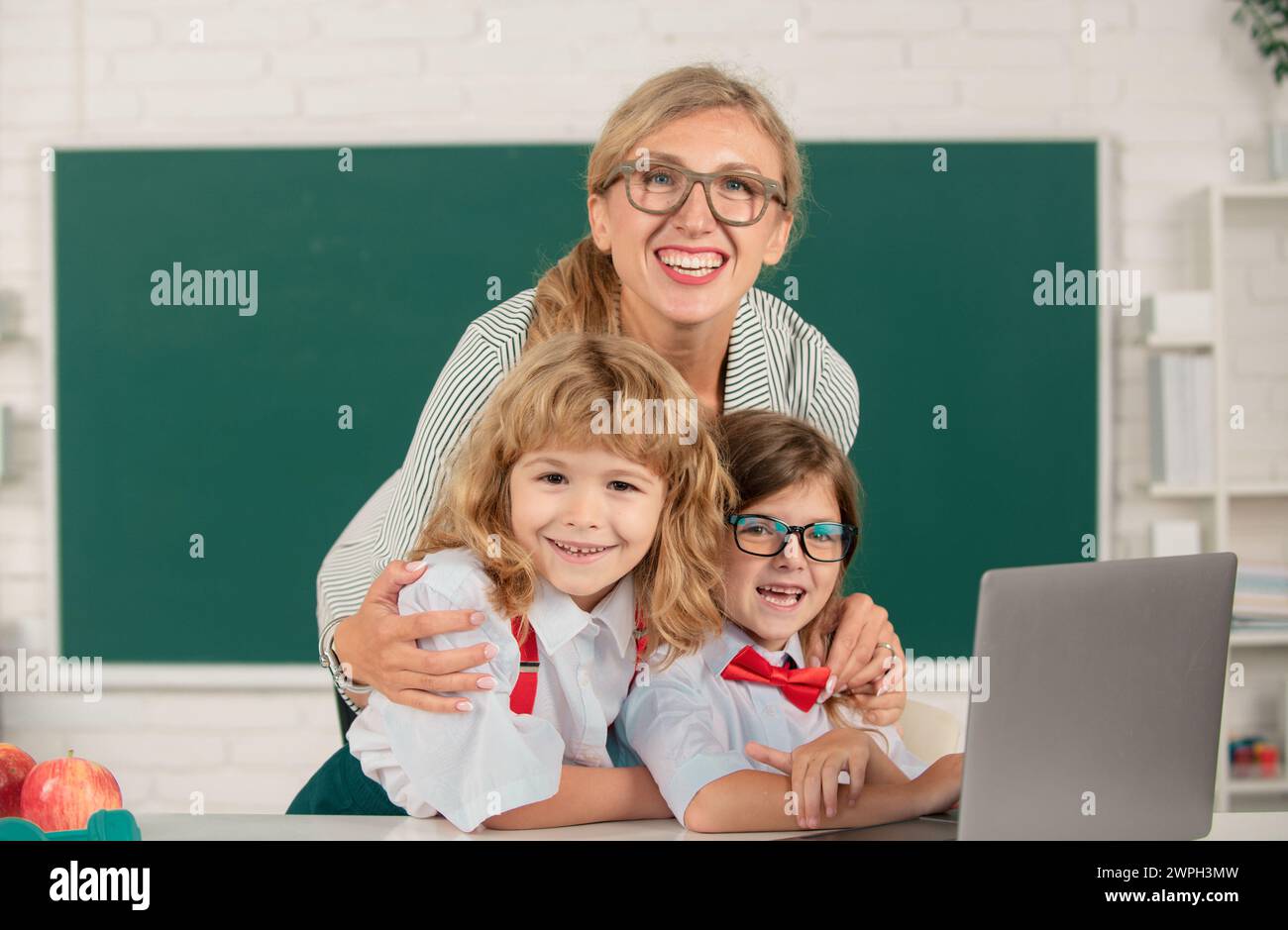 First day at school. Cute little boy from elementary school and tutor ...