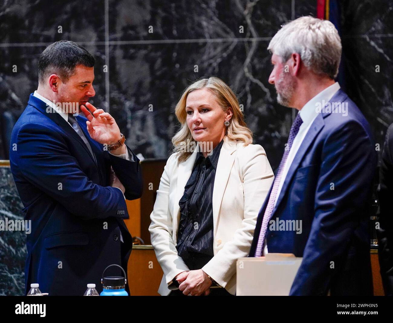Oakland County Assistant Prosecutor Marc Keast, left, speaks with ...