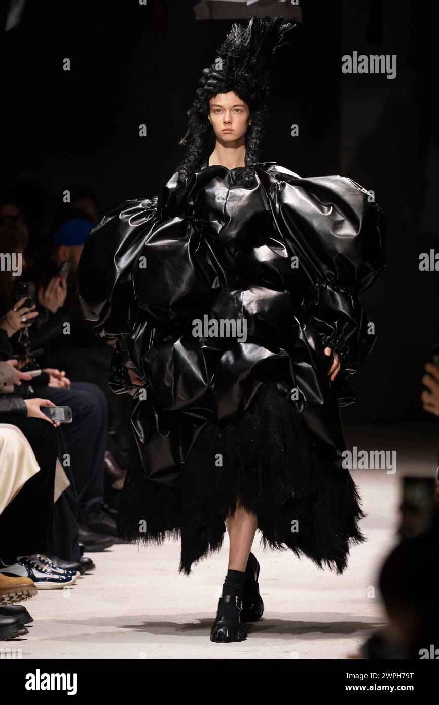 A model wears a creation as part of the Comme Des Garcons Fall/Winter ...