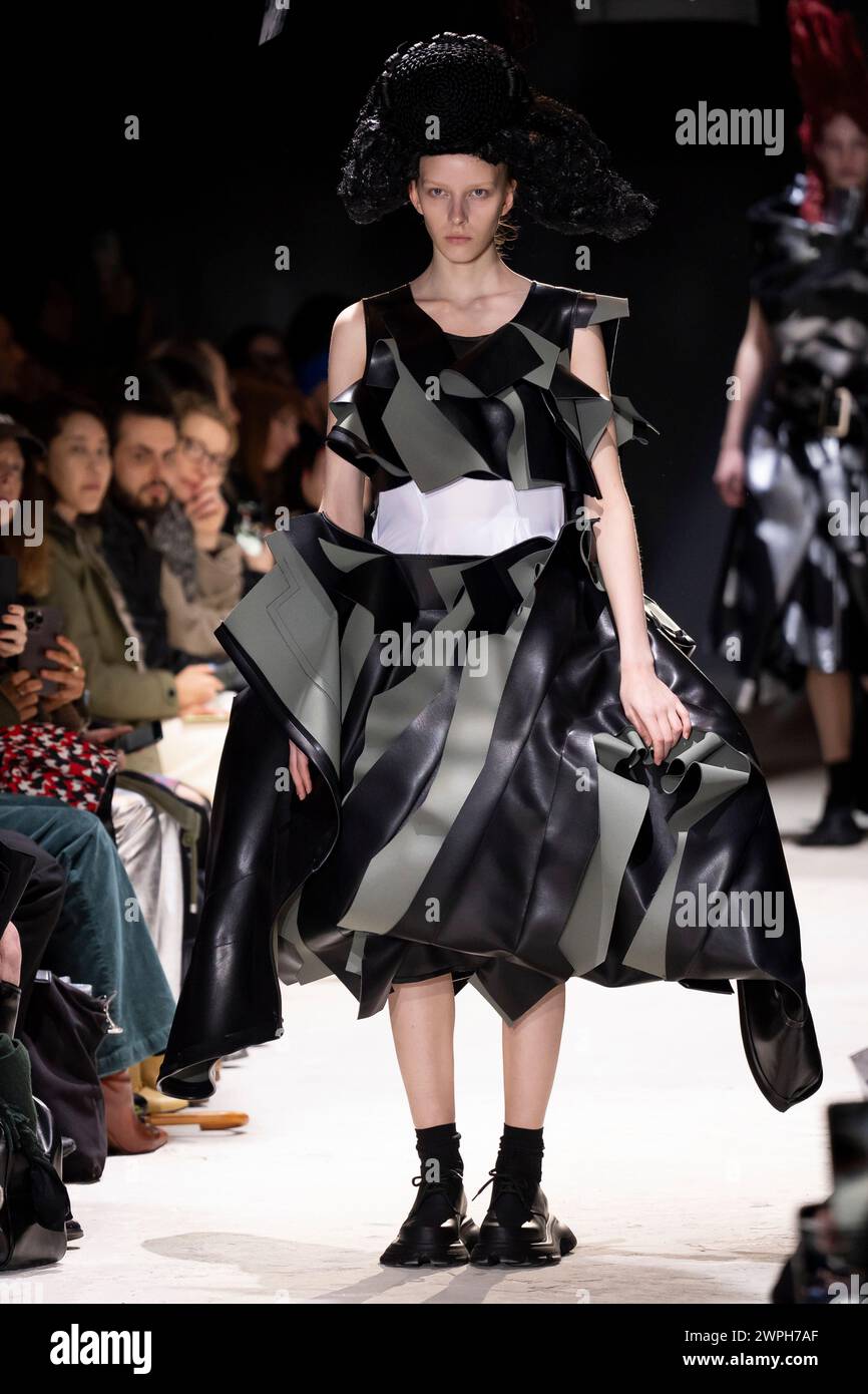 A model wears a creation as part of the Comme Des Garcons Fall/Winter ...