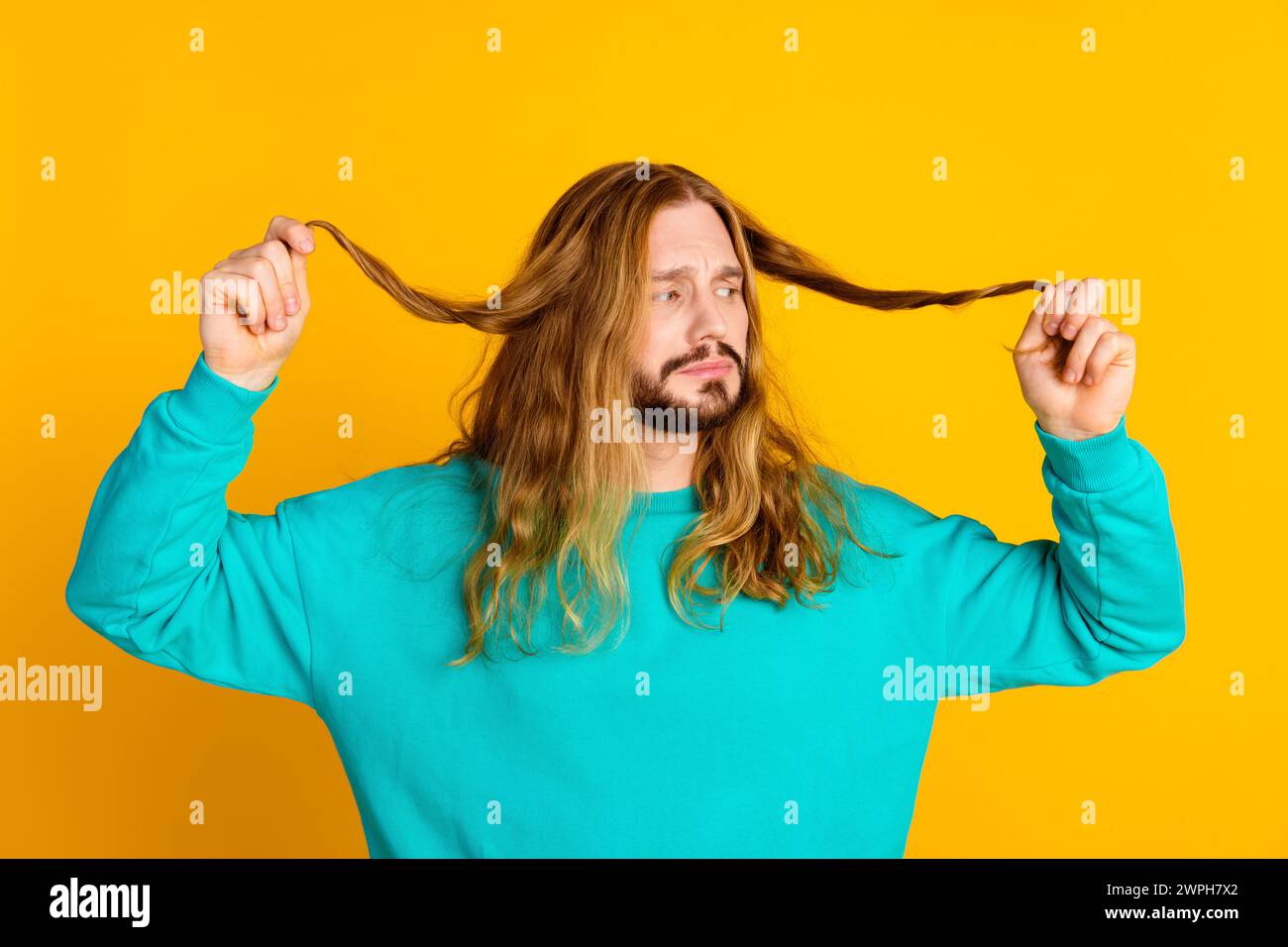 Photo of unsatisfied man hands fingers hold split weak hair ends ...
