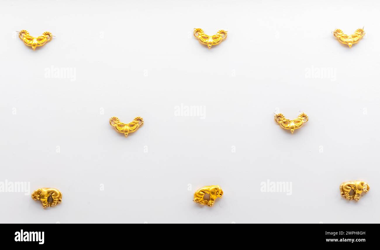 Gold plaques in an animal form - feline (top), goat and bird (bottom ...