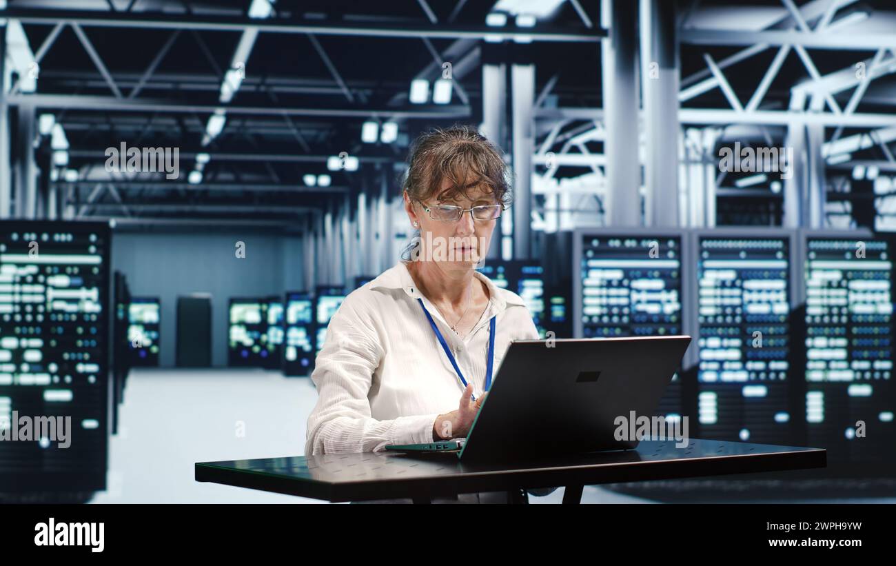 Certified employee working in server hub housing GPU dedicated supercomputers that can process ...