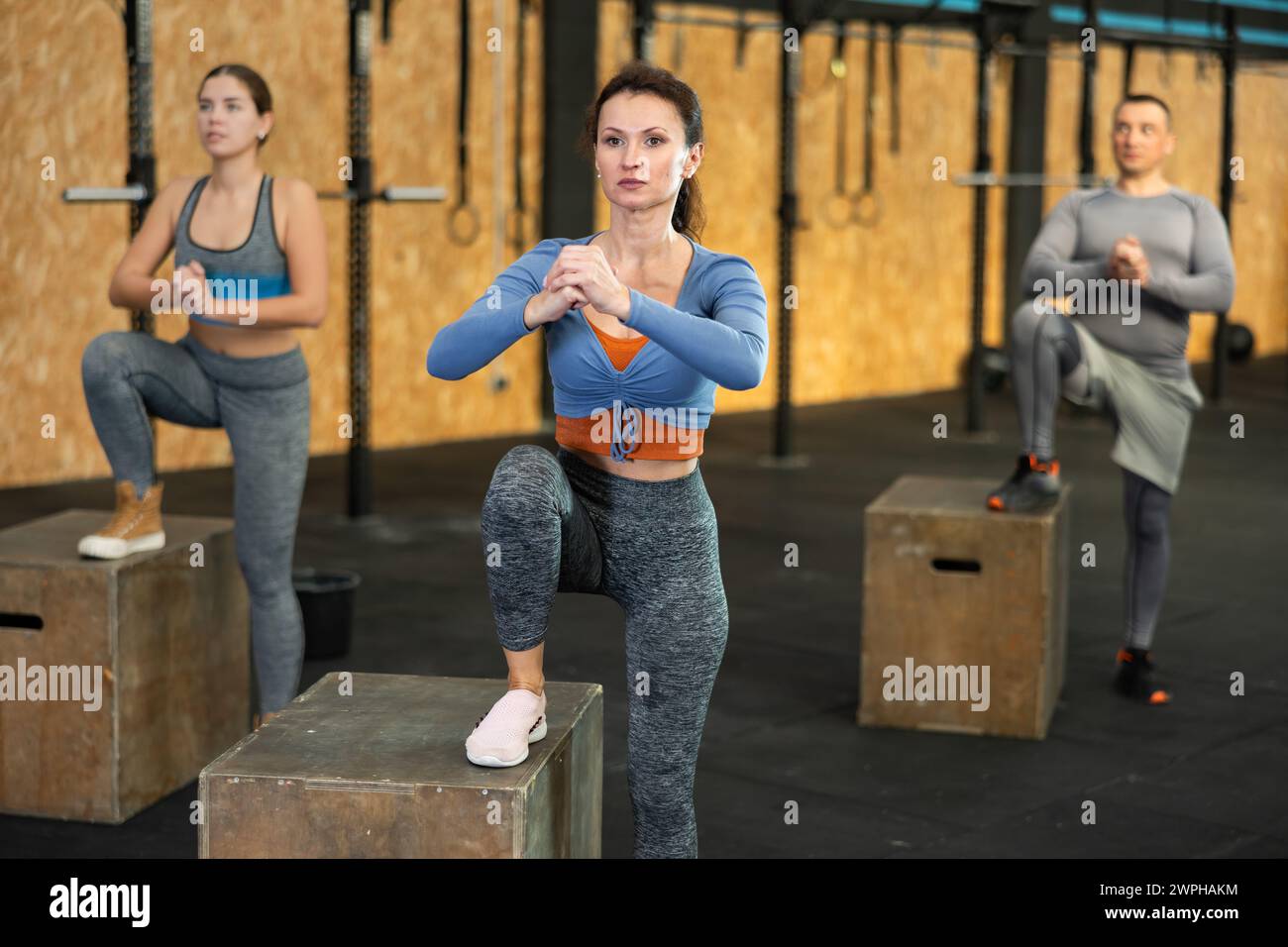 Woman performs exercises squats, hill climbing, kettlebell squats using ...