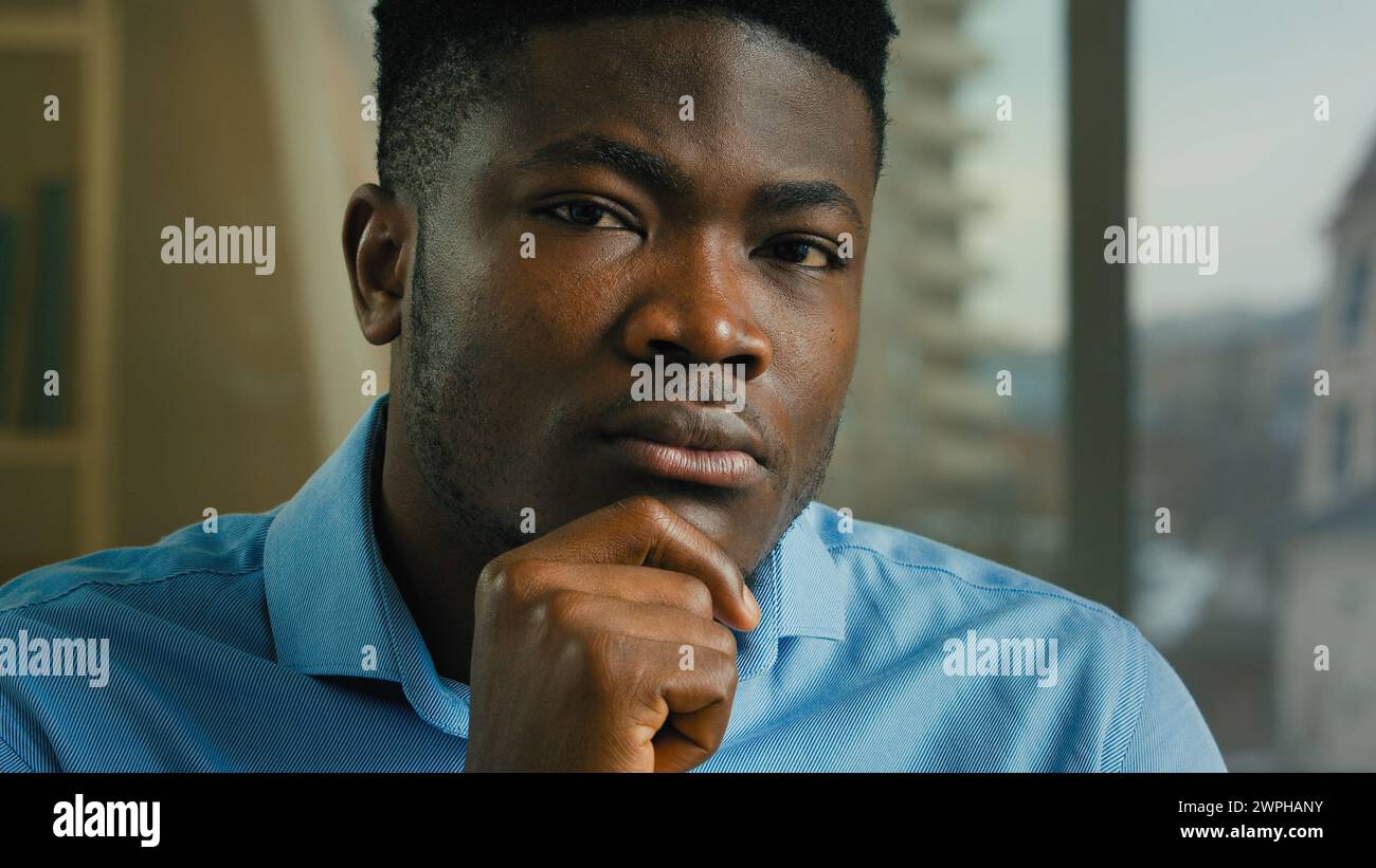 Head shot African American man ethnic thoughtful businessman think hold ...