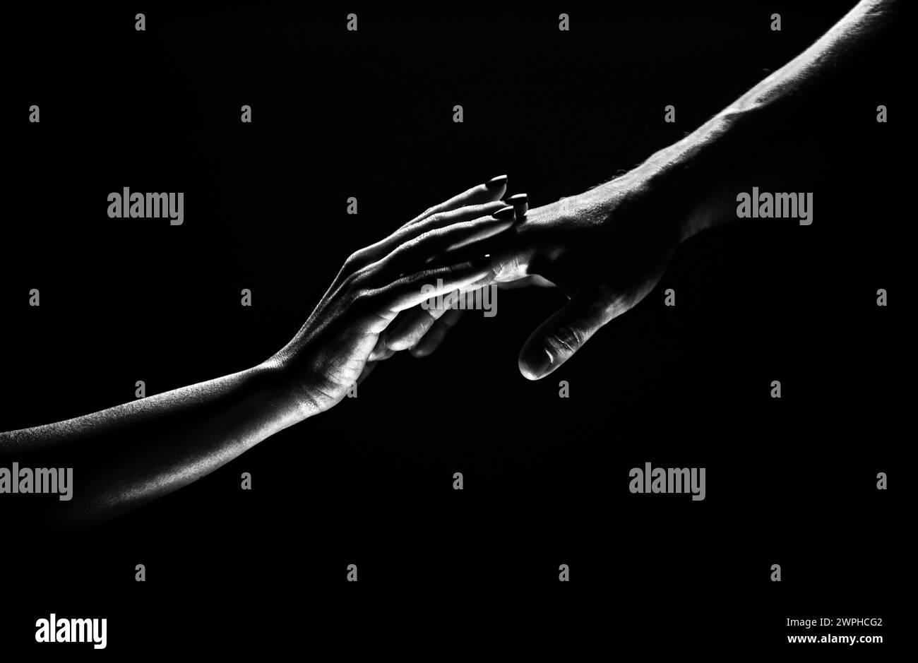 Two hands at the moment of farewell. The holding hands of relations ...