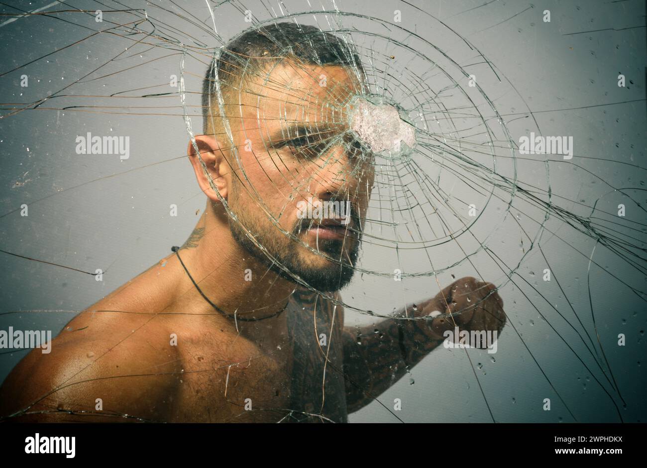 Gangster man, cracked glass. Ready to fight. Man boxing, strength and ...