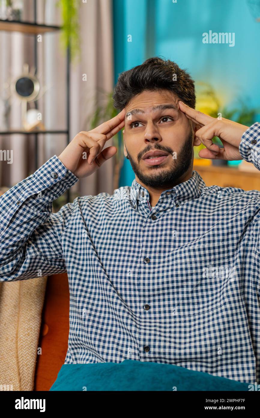 Sick ill Indian man rubbing temples to cure headache problem, suffering ...