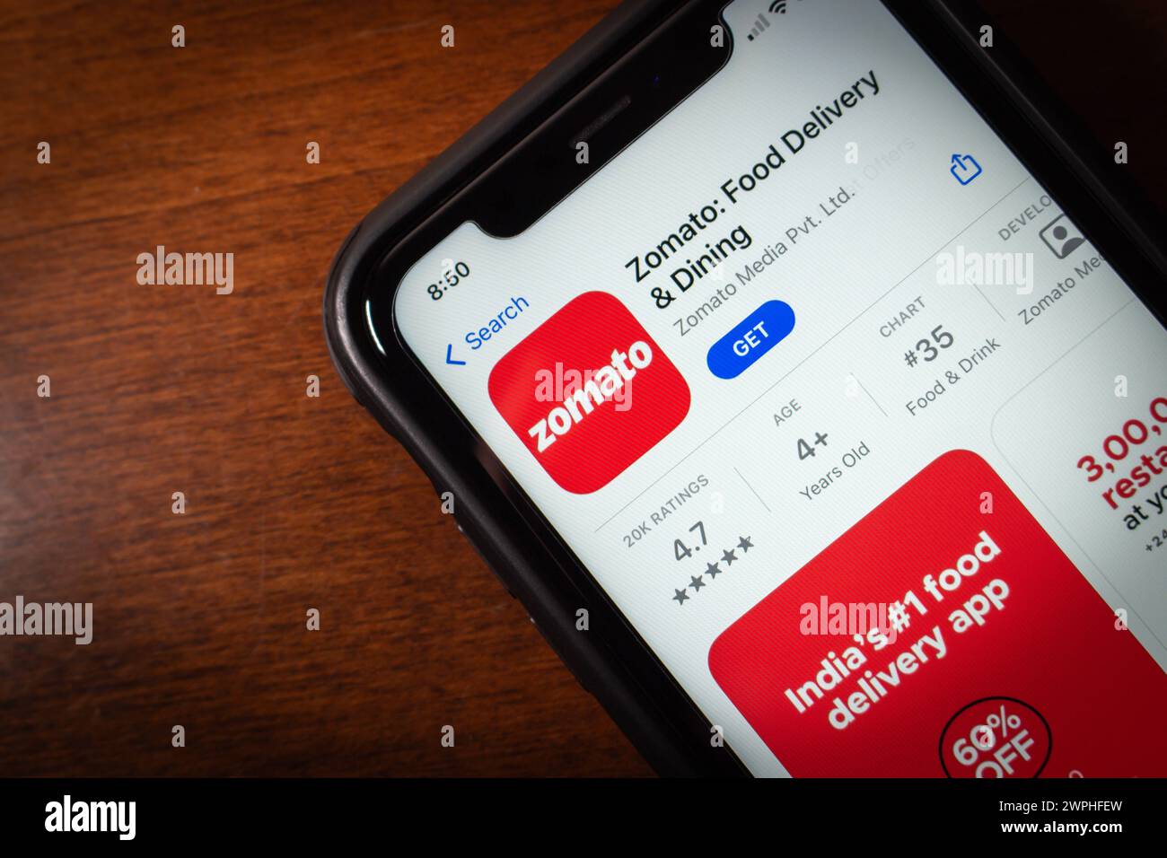 Zomato app seen in App Store on iPhone. Zomato is an Indian ...