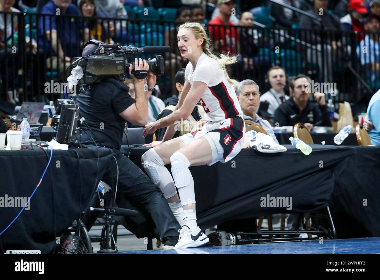 Stanford forward Cameron Brink, center, runs into a camera operator ...