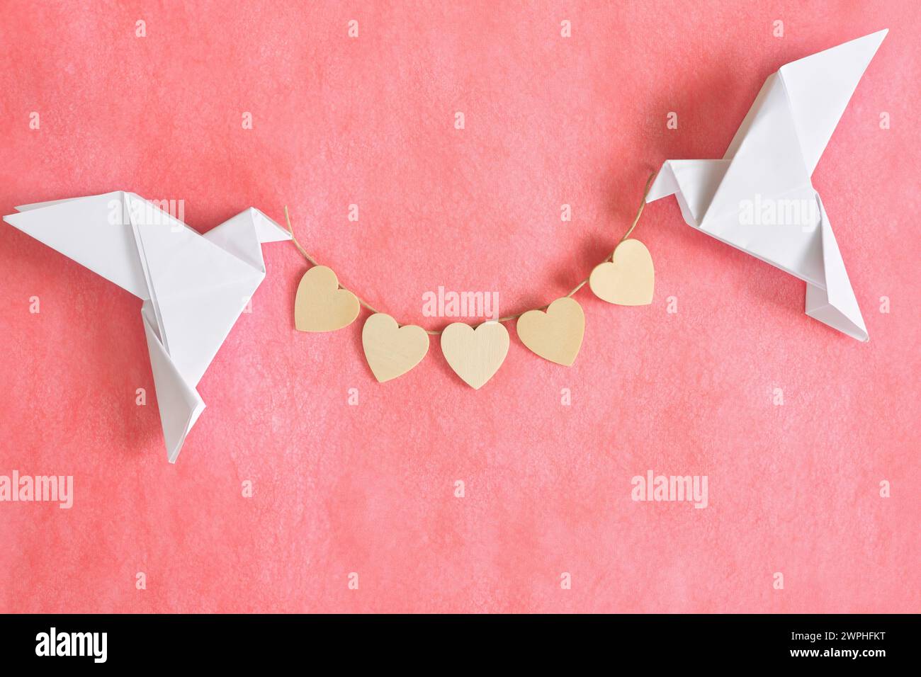 Message of pure love concept. Two white dove origami carrying heart ...