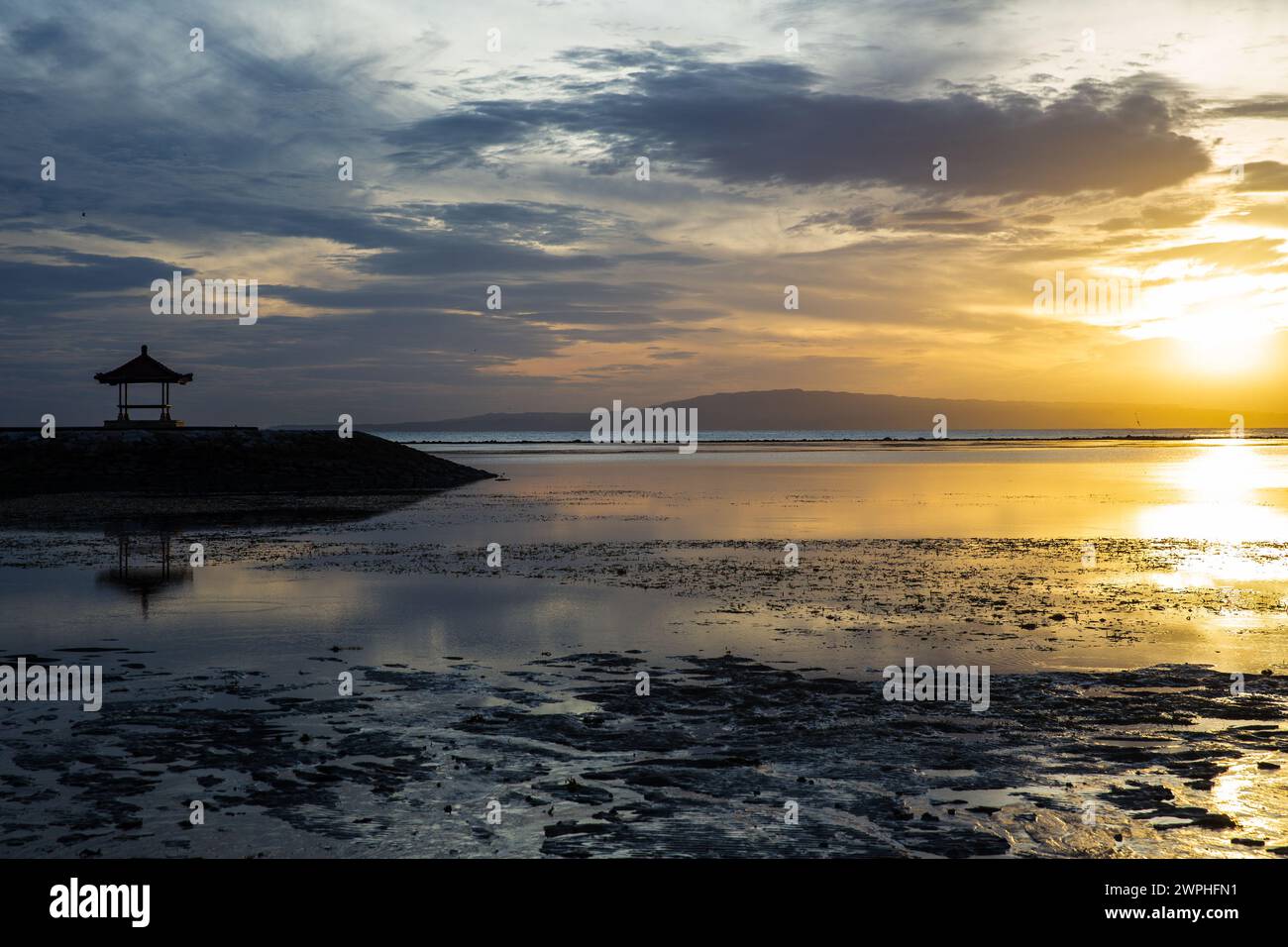 Sunrise in Bali with a Balinese Pavilion Stock Photo - Alamy