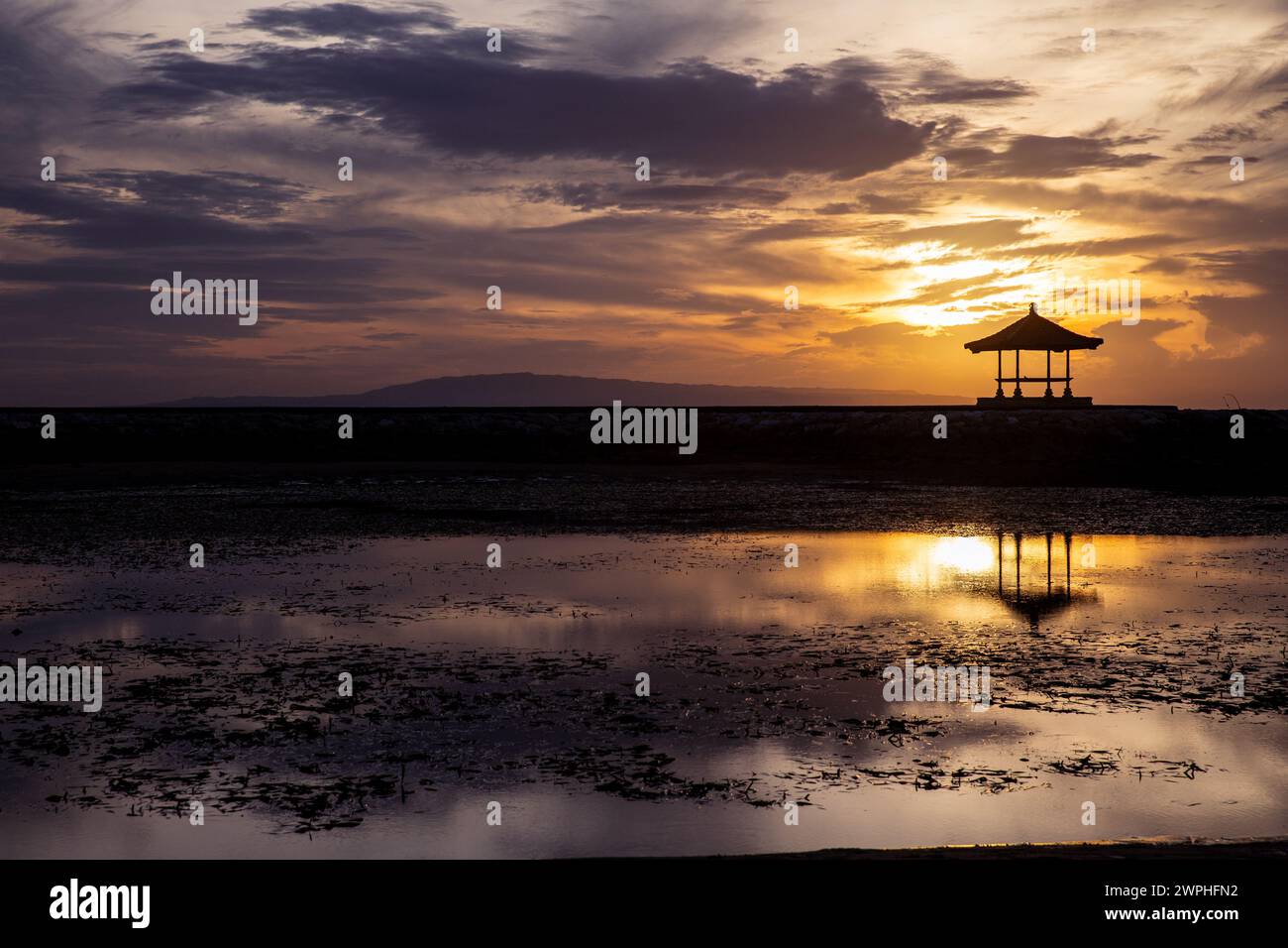 Sunrise in Bali with a Balinese Pavilion Stock Photo - Alamy