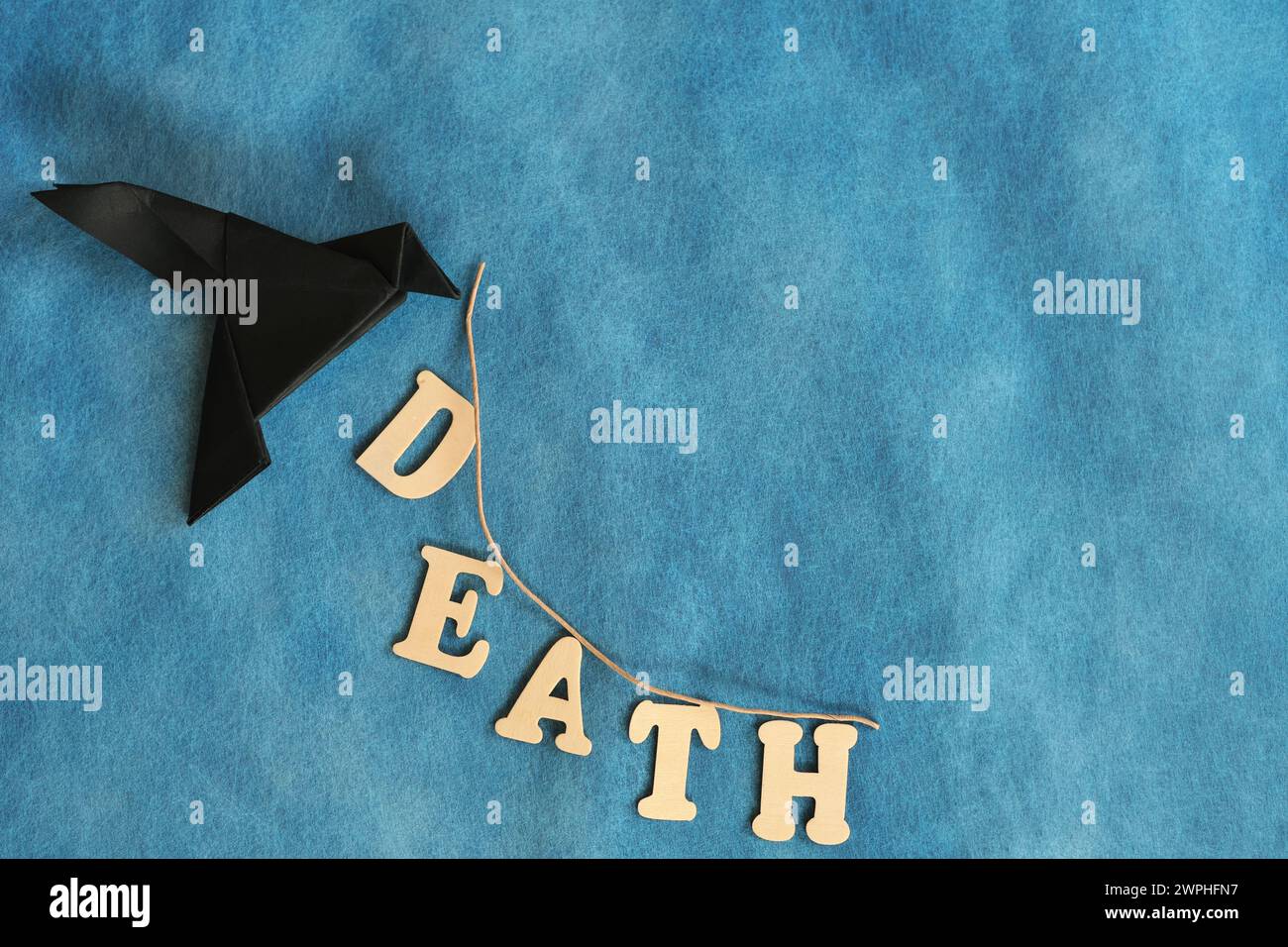 Message of death concept. Black raven or crow paper origami carrying ...