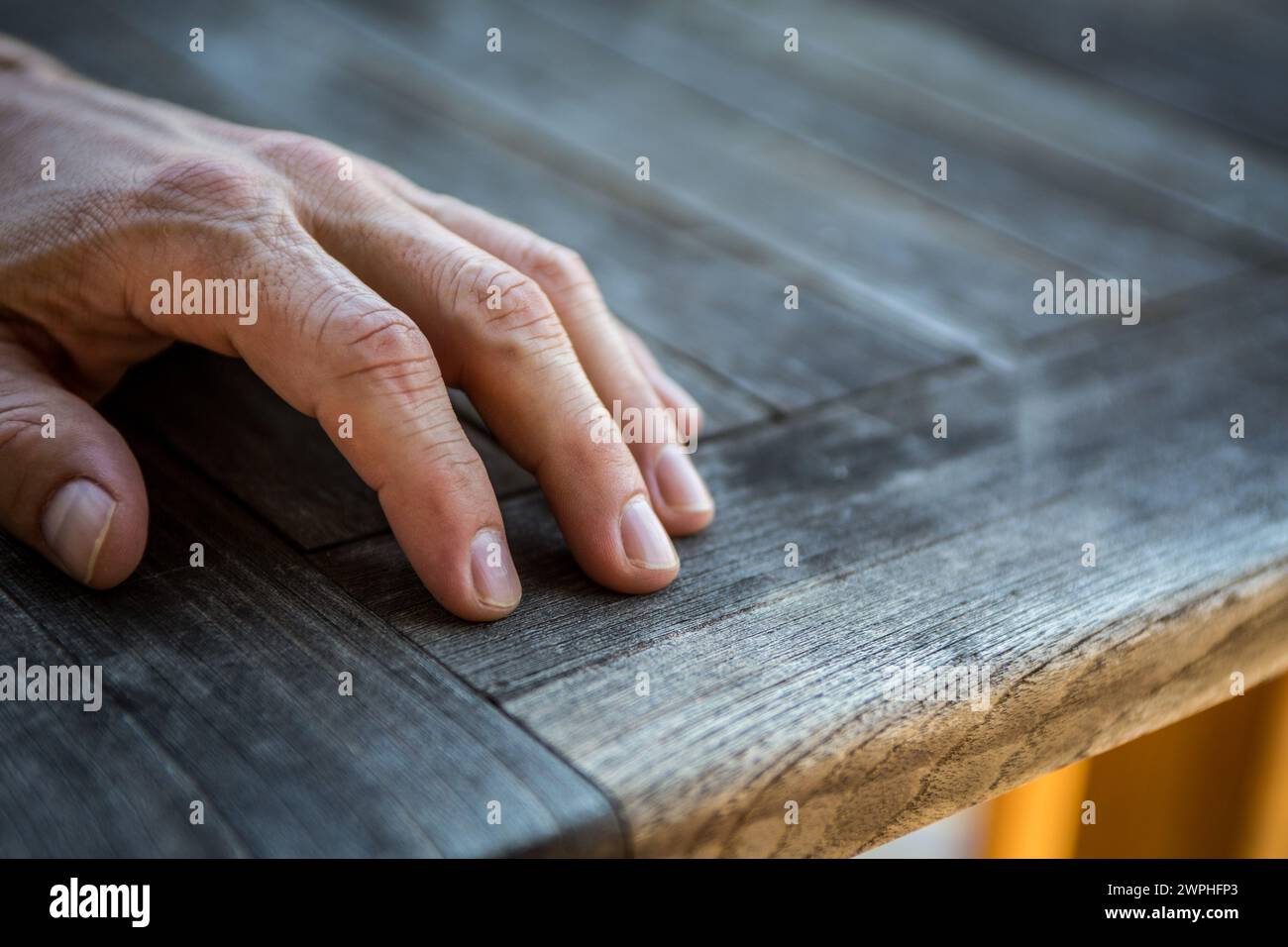 Hand man resting on table hi-res stock photography and images - Alamy