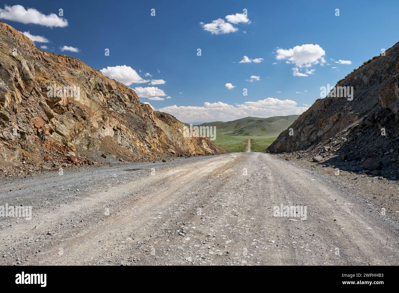 View on road, mountains and sky with clouds from the Obotyn-Daba ...