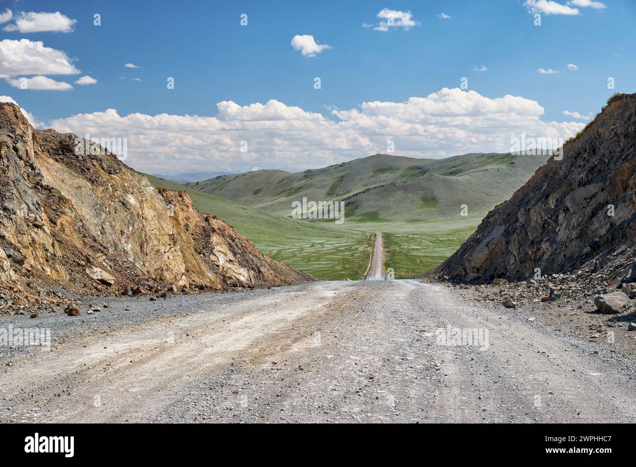 View on road, mountains and sky with clouds from the Obotyn-Daba ...