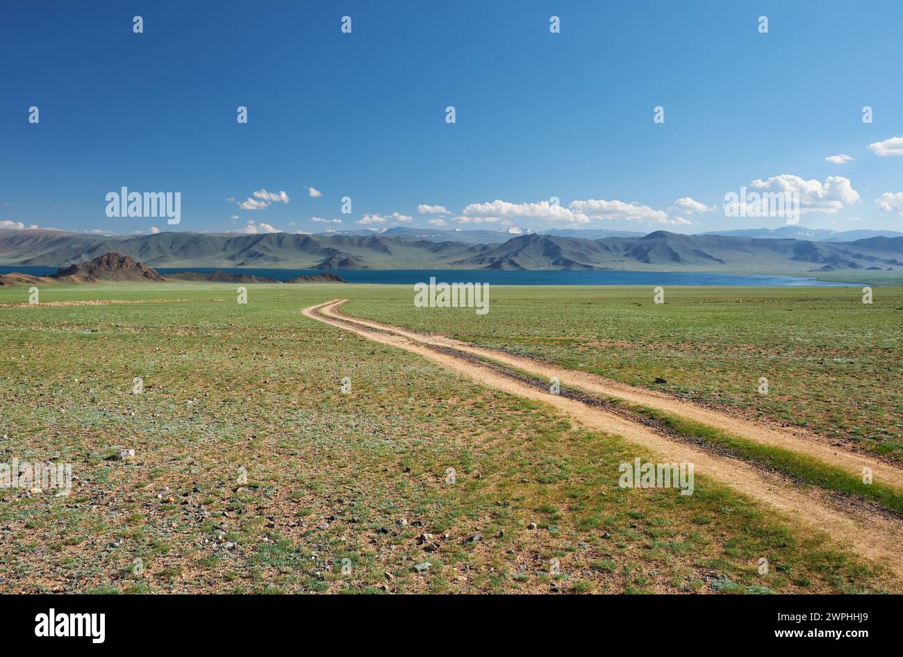 Mongolian natural landscapes with country road to the lake Tolbo-Nuur ...