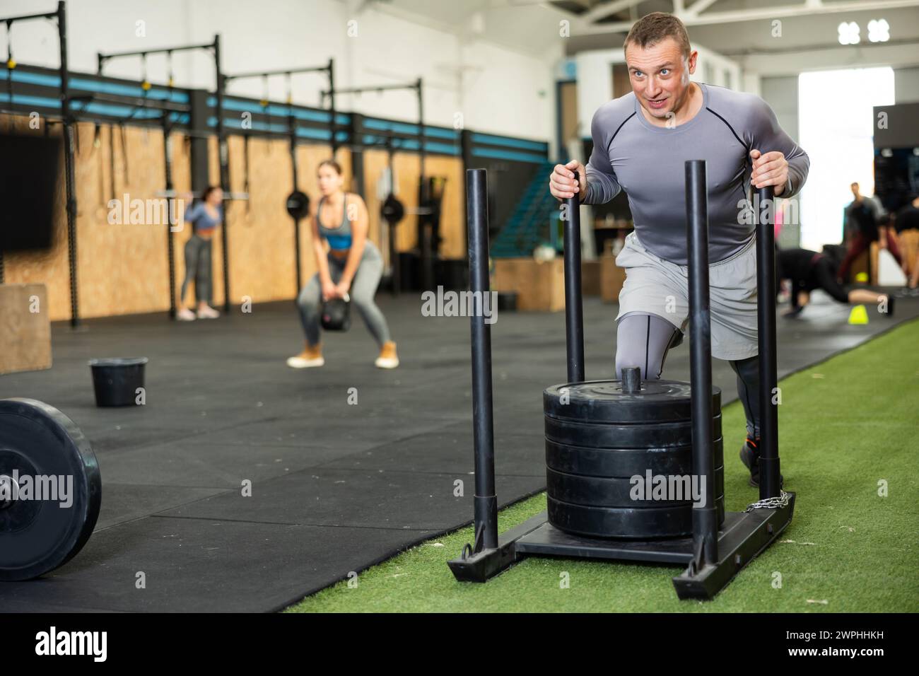 Man during grueling workout with element of push and pull superset in ...