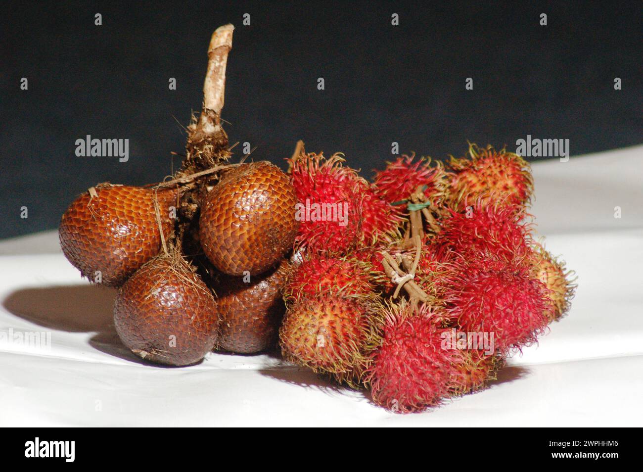 A bunch of rambutan and snake fruit Stock Photo - Alamy