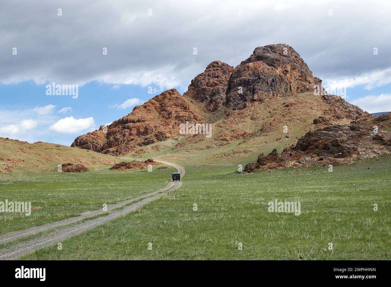 Mongolian natural landscapes with car on country road to the lake Tolbo ...