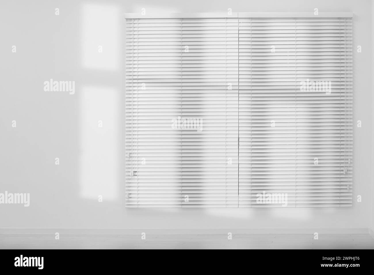 Light and shadows from window on wall indoors Stock Photo - Alamy