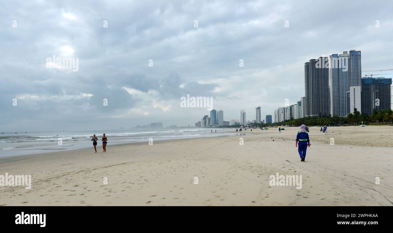The beautiful long white sand beach along the changing waterfront ...